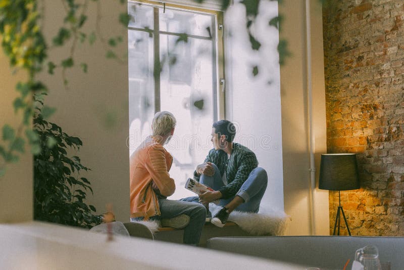 Two Men Near The Window Talking Picture. Image: 116504868