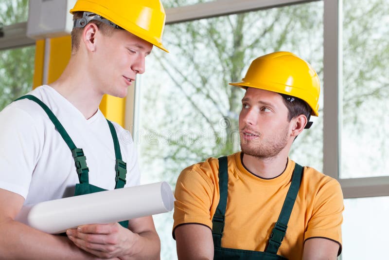 Two Men in Overalls and Hardhat during Work Stock Photo - Image of ...