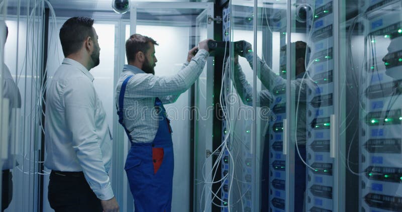 Two Men Performing Maintenance in a Data Center Stock Video - Video of ...