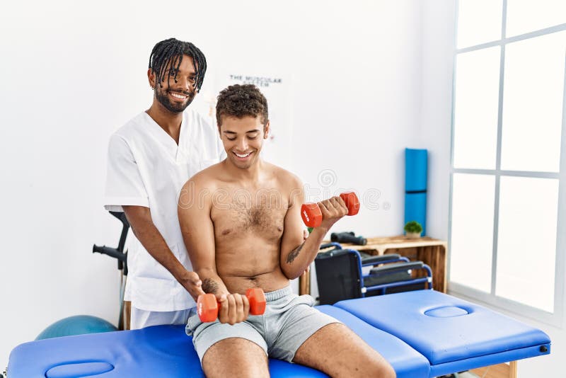 Two Men Physiptherapist and Patient Having Rehab Session Using Dumbbell ...