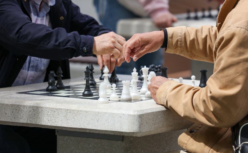 Two Men Playing Chess on a Table Stock Image - Image of chess, queen ...