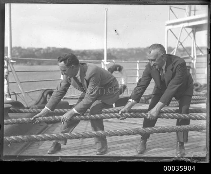 Two Men Pulling on Ropes on Deck of SS RUNIC, 1920s Stock Image - Image ...