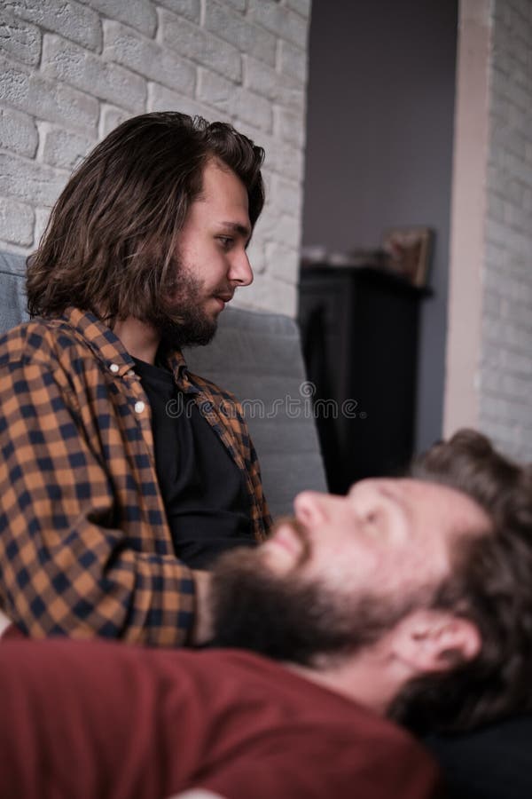 Two Men Relaxing Together on the Sofa Stock Image - Image of boyfriend ...