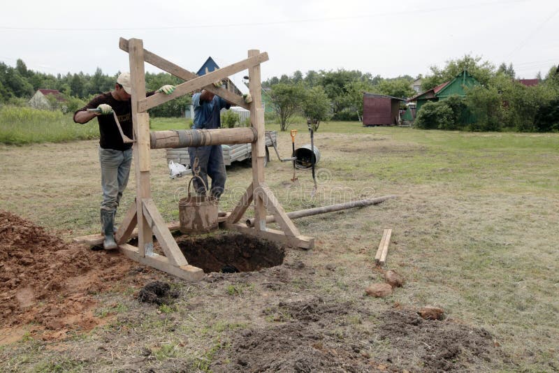 Two Men Removed Soil Well Stock Photos - Free & Royalty-Free Stock ...