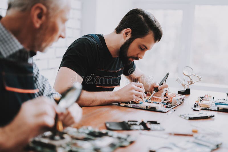 Two Men Repairing Hardware Equipment from PC. Stock Photo - Image of ...