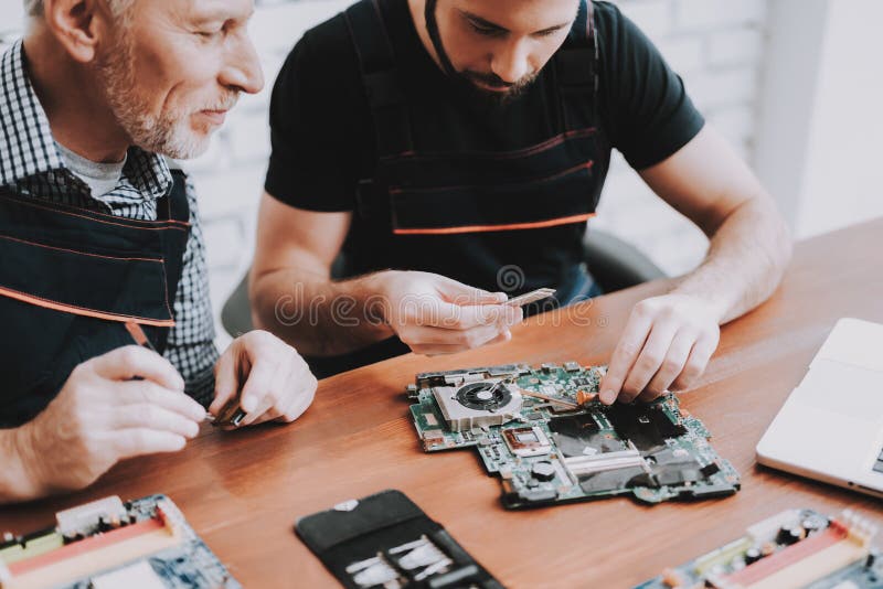 Two Men Repairing Hardware Equipment from PC. Stock Photo - Image of ...