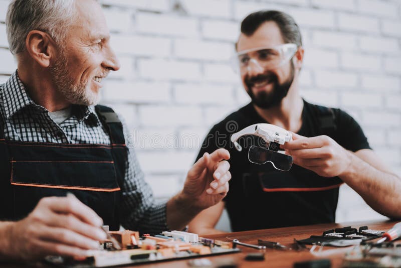 Two Men Repairing Hardware Equipment in Workshop Stock Photo - Image of ...