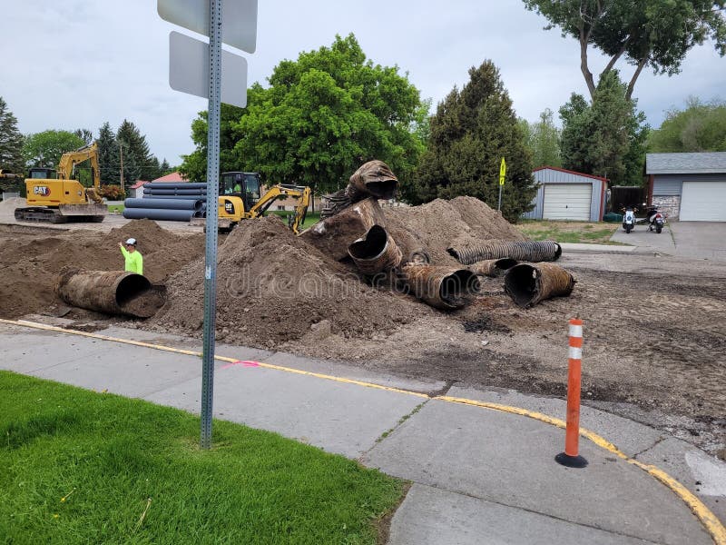 Two Men Replacing Water Lines in Street Construction Project Stock ...
