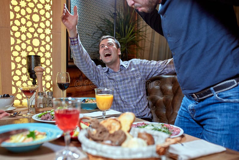 Two Men in a Restaurant Arguing during Lunch Stock Photo - Image of ...