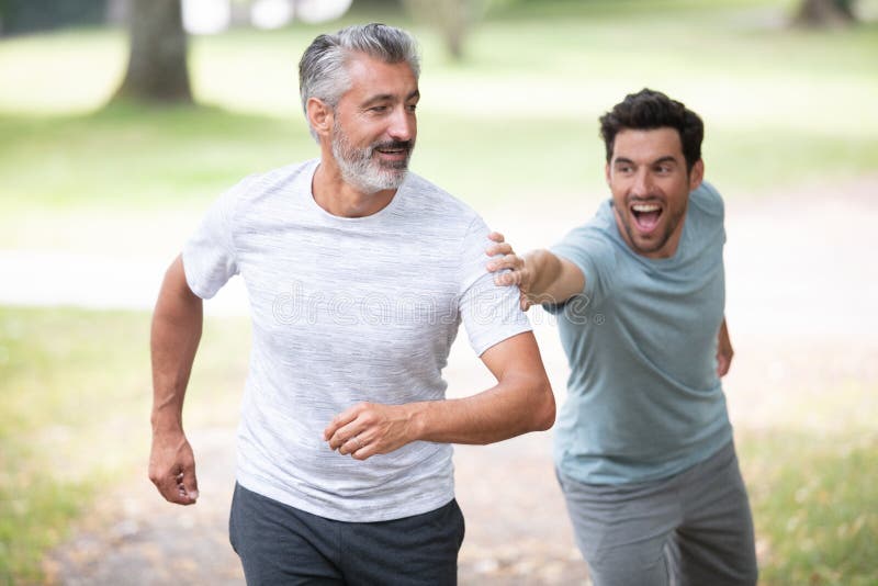 Two men running together stock photo. Image of mustache - 266081866
