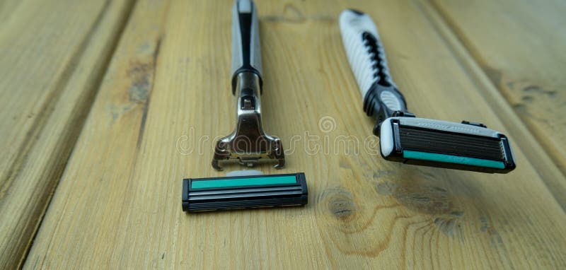 Two Men`s Razors with Replaceable Cartridges are on the Table Stock ...