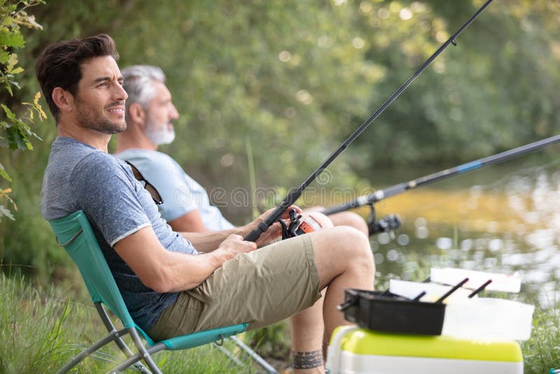 Two Men Sat Peacefully Fishing Stock Photo - Image of fatherson ...