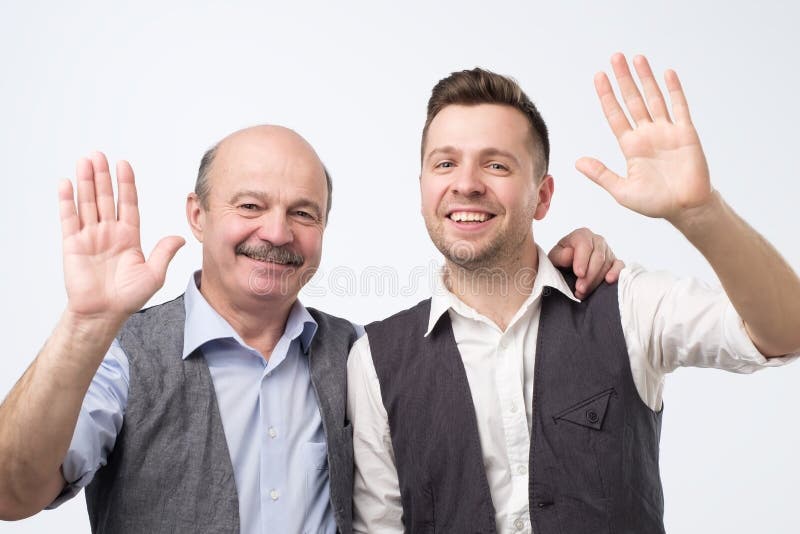 Two Men Saying Hello, Waving a Hand Stock Image - Image of emotion ...