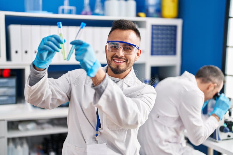 Two Men Scientists Holding Test Tubes Using Microscope at Laboratory ...
