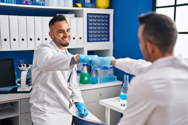 Two Men Scientists Smiling Confident Hugging Each Other at Laboratory ...