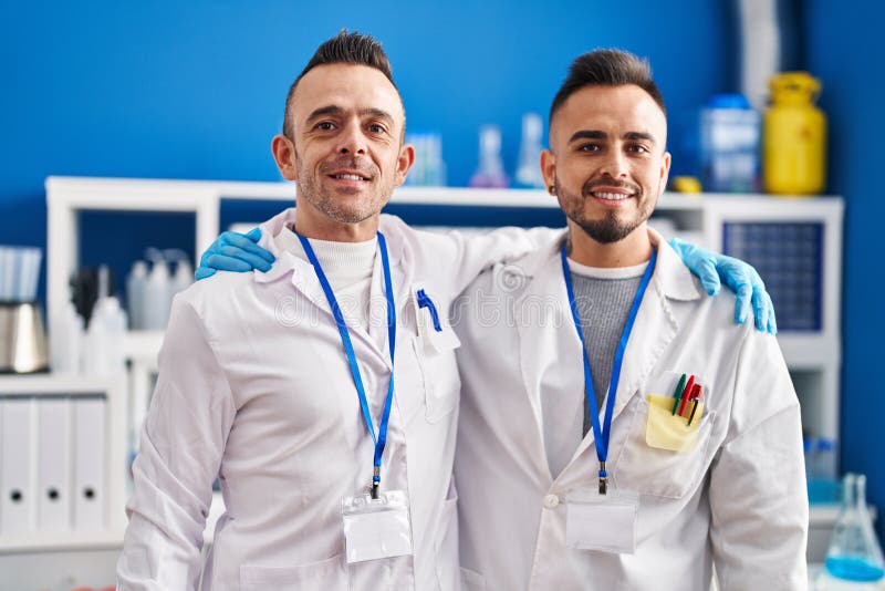 Two Men Scientists Smiling Confident Hugging Each Other at Laboratory ...