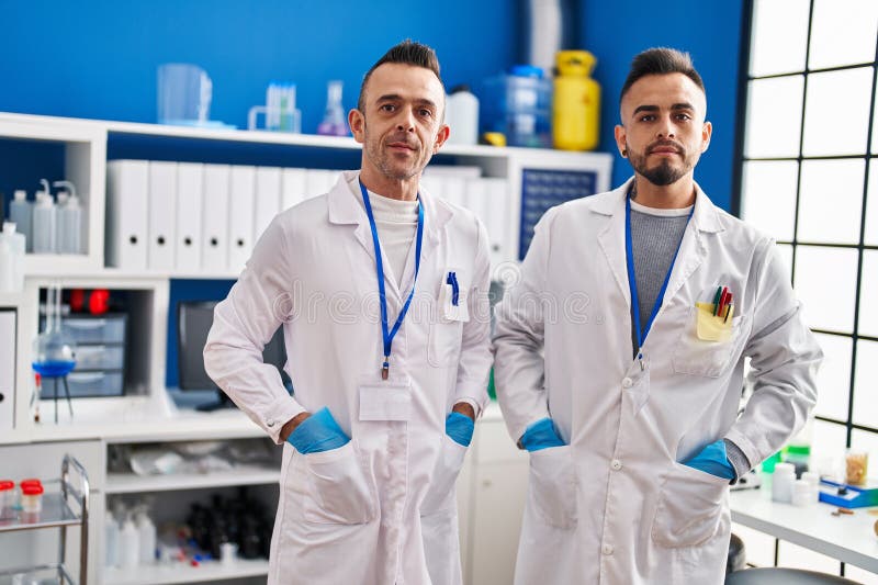 Two Men Scientists Standing with Relaxed Expression at Laboratory Stock ...