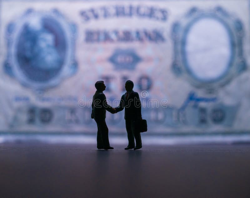 Two Men Shaking Hands in Front of a Large Bank Note.. Stock Photo ...