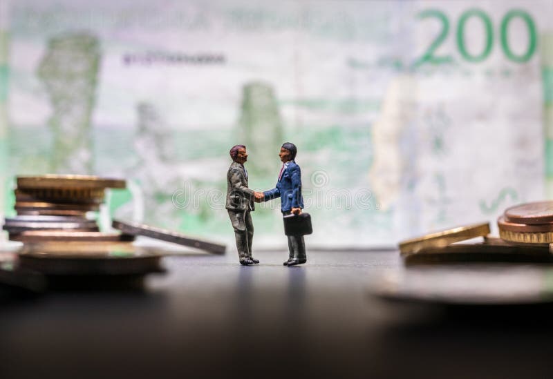 Two Men Shaking Hands in Front of a Large Bank Note.. Stock Photo ...