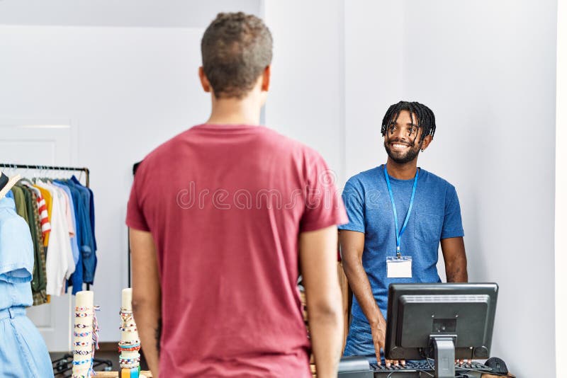 Two Men Shopkeeper and Customer Standing at Clothing Store Stock Photo ...