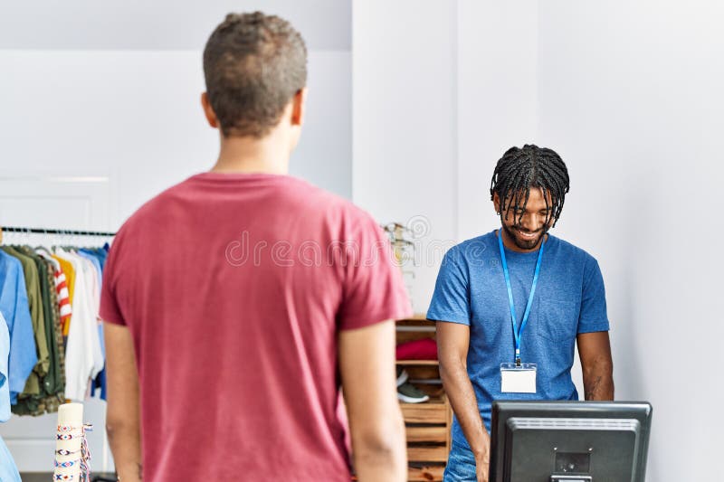 Two Men Shopkeeper and Customer Standing at Clothing Store Stock Image ...