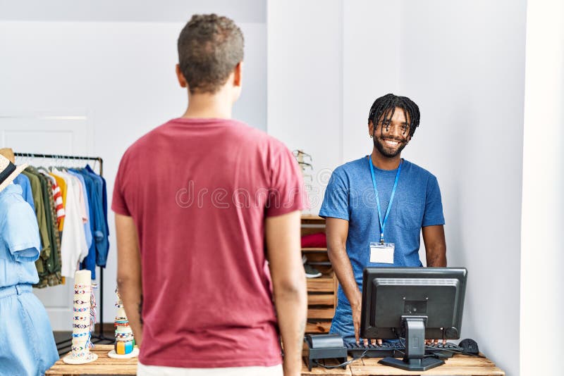 Two Men Shopkeeper and Customer Standing at Clothing Store Stock Photo ...