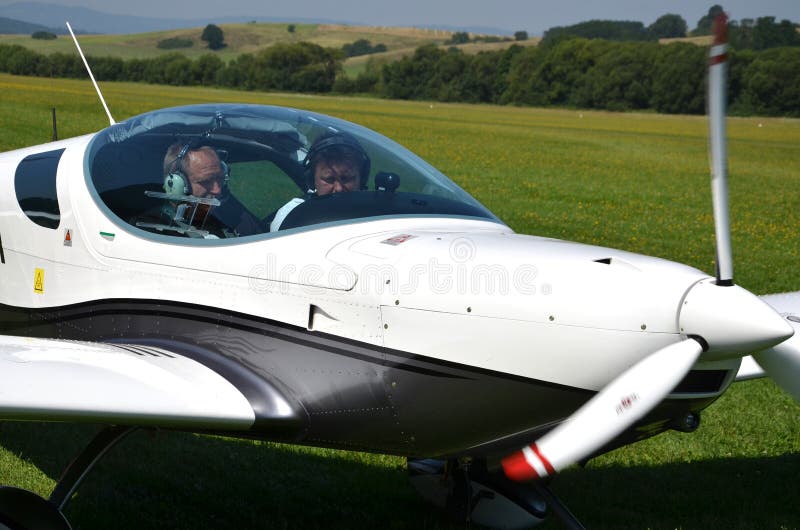 Two Men Sit into Ultralight Propeller-driven Airplane and Get Ready for ...