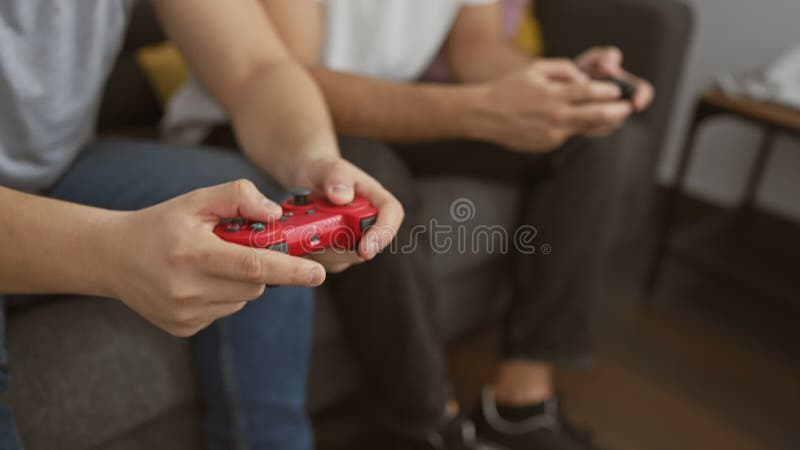 Two Men Sitting Indoors Engaging in Competitive Console Gaming ...