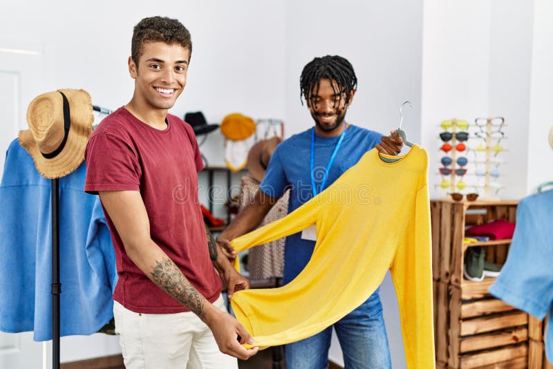 Two Men Smiling Confident Choosing Clothes at Clothing Store Stock ...