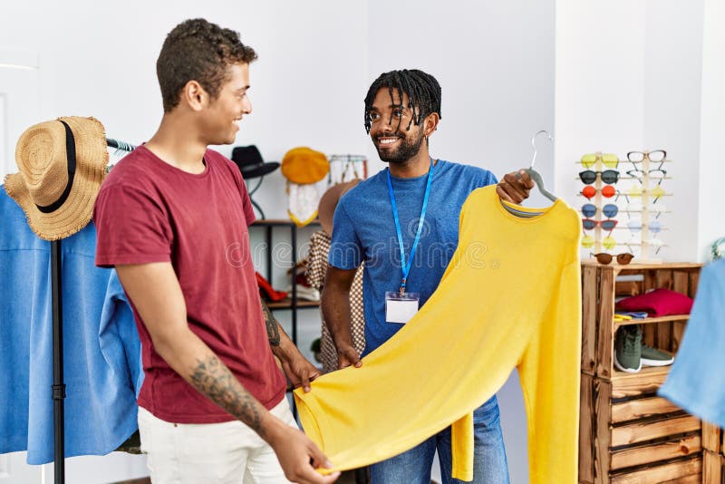 Two Men Smiling Confident Choosing Clothes at Clothing Store Stock ...