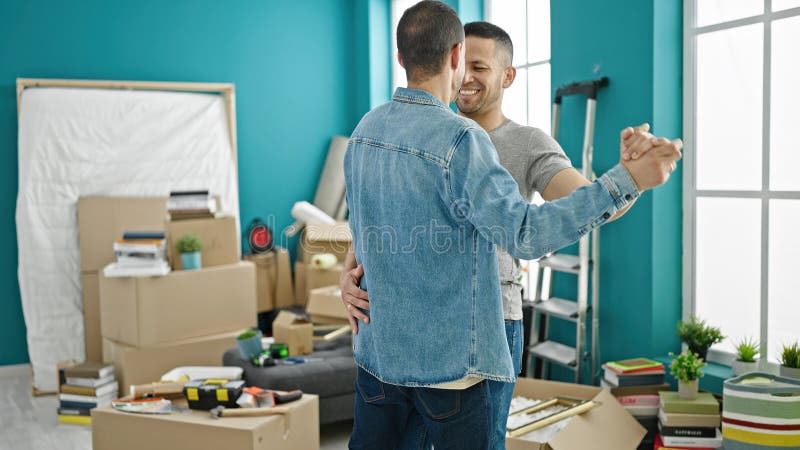 Two Men Smiling Confident Dancing at New Home Stock Image - Image of ...