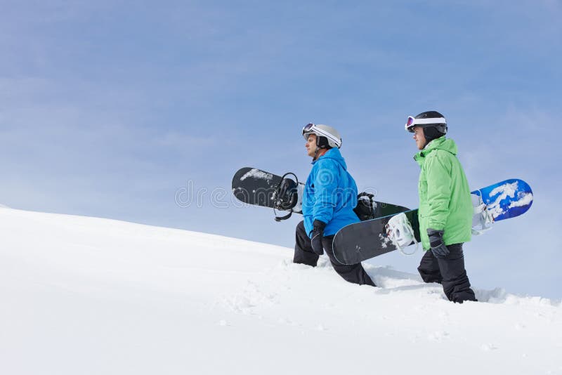 Two Men with Snowboards on Ski Holiday in Mountains Stock Image - Image ...