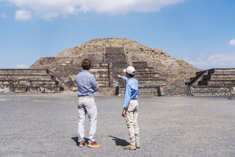 Two Men Stand in Front of the Pyramid of the Moon in Teotihuacán ...