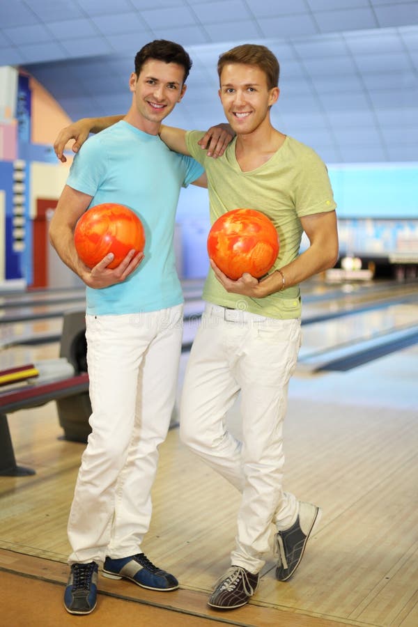 Two Men Stand Together in Bowling Club Stock Image - Image of alley ...