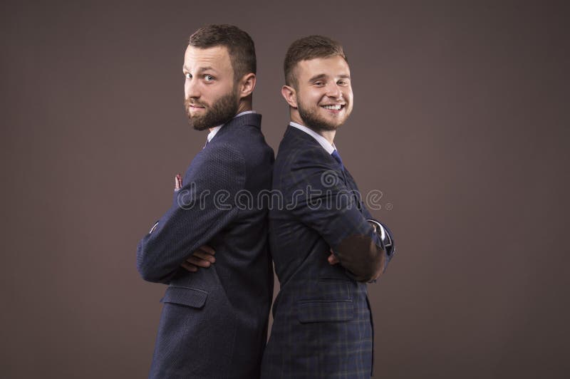 Two Men Standing Back To Back Stock Image - Image of confidence, people ...