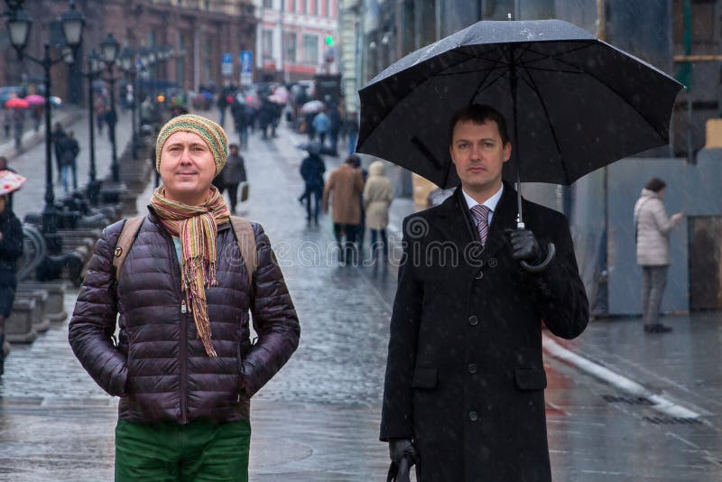 Two Men are Standing on the Street, One of Them is Sad, the Other is ...