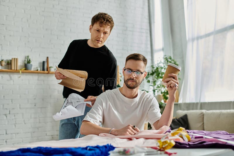 Two men, a table, and a stock photo. Image of passion - 323876818