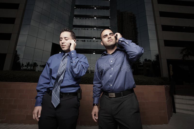 Two Men Talking on Cellphones Stock Photo - Image of people, talking ...