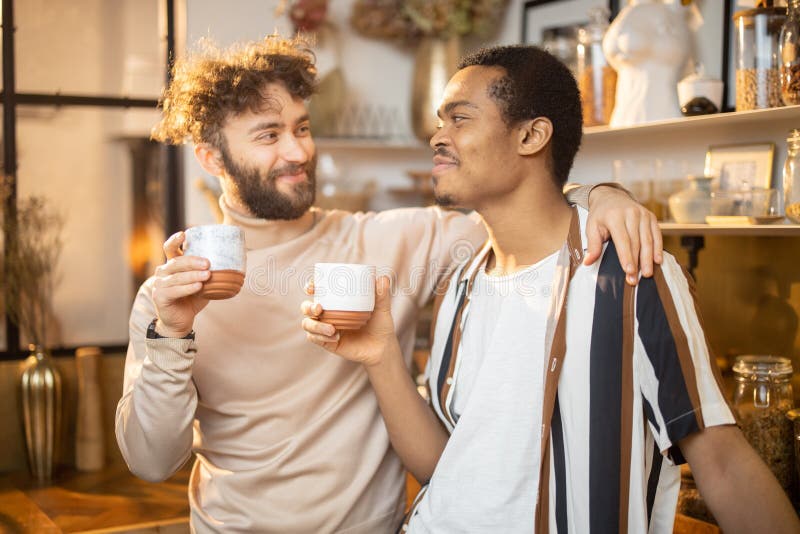 Two Men Talking and Drinking Coffee on Kitchen at Home Stock Image ...