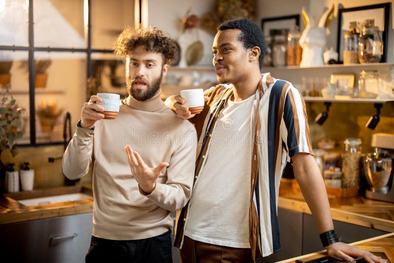 Two Men Talking and Drinking Coffee on Kitchen at Home Stock Image ...