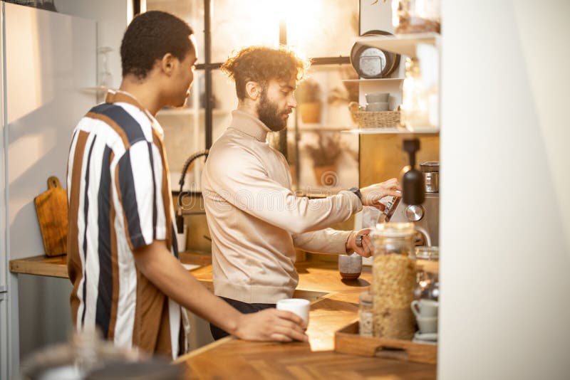 Two Men Talking and Drinking Coffee on Kitchen at Home Stock Photo ...