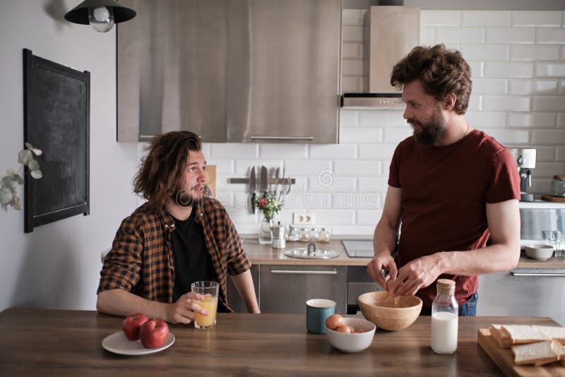 Two Men Talking in the Kitchen Stock Photo - Image of relationship ...