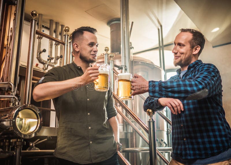 Two Men Tasting Fresh Beer in a Brewery Stock Image - Image of owner ...