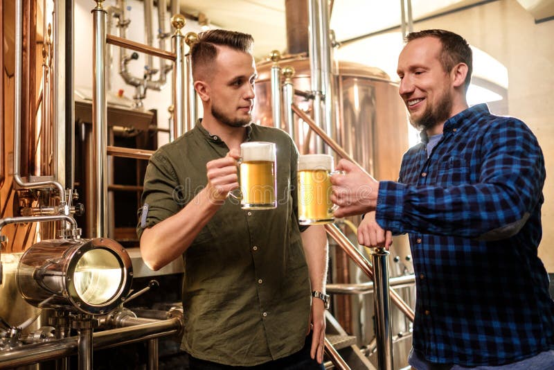 Two Men Tasting Fresh Beer in a Brewery Stock Photo - Image of beverage ...