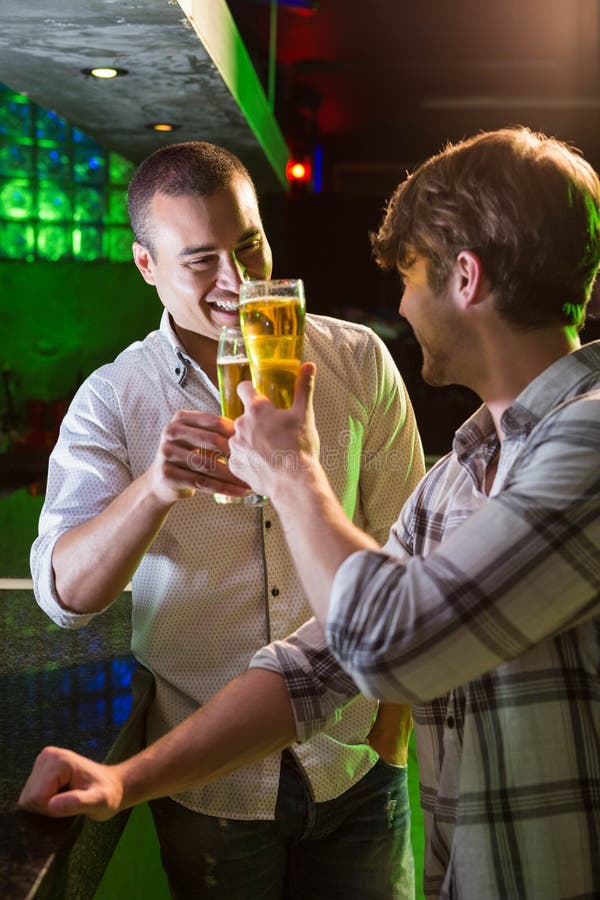 Two men toasting with beer stock image. Image of cheers - 177816117