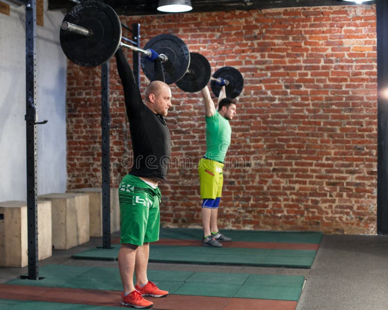 Two Men are Training at the Gym Stock Image - Image of press, team ...
