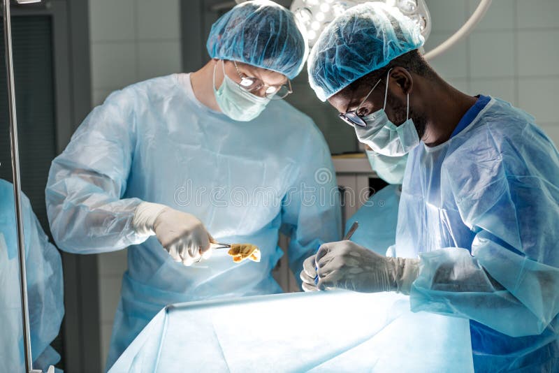 Two Men Treating Sick Patient, Doctors Using New Methods of Medicine ...