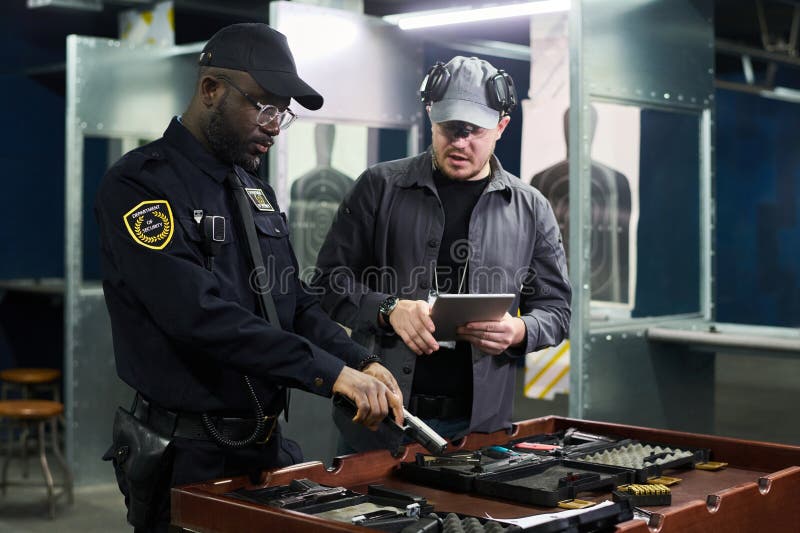 Collaborating in Shooting Range for Firearm Maintenance Stock Photo ...