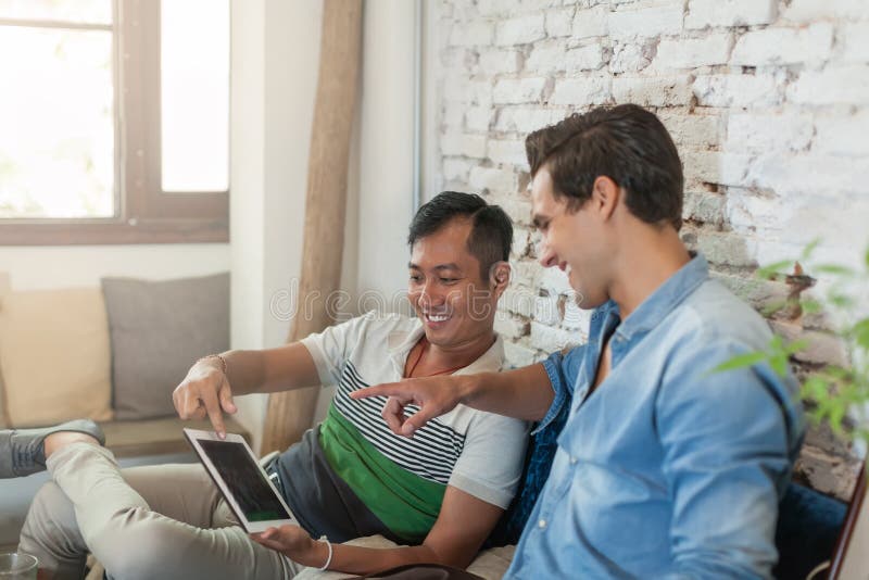 Two Men Using Tablet Computer Internet at Cafe Stock Photo - Image of ...