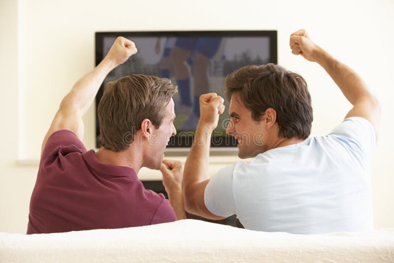 Two Men Watching Widescreen TV at Home Stock Image - Image of sofa ...